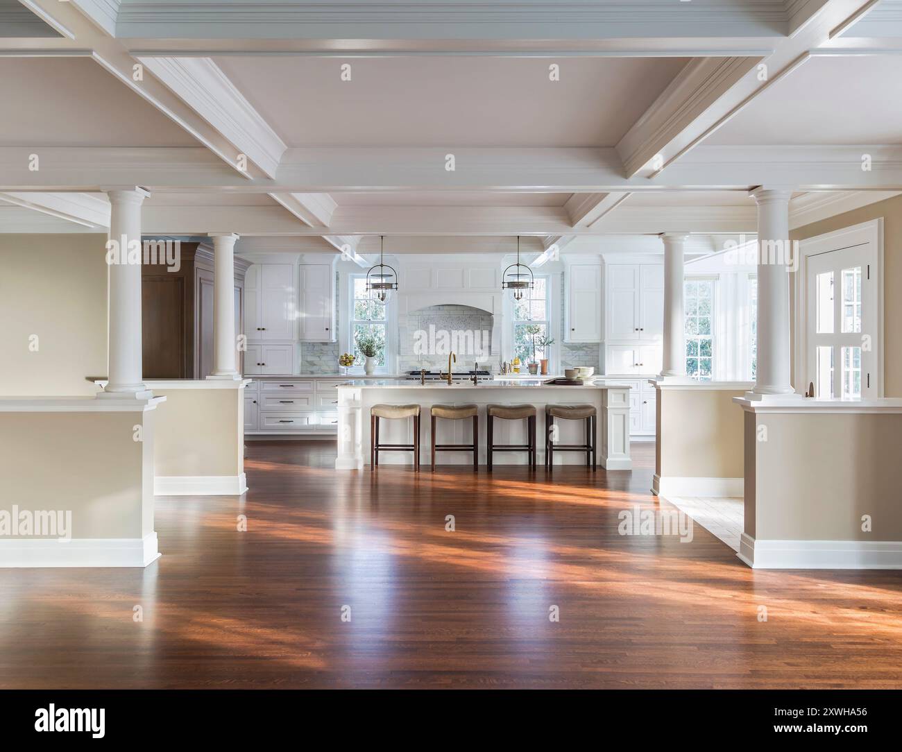 Grand white kitchen with pillars on either side Stock Photo - Alamy