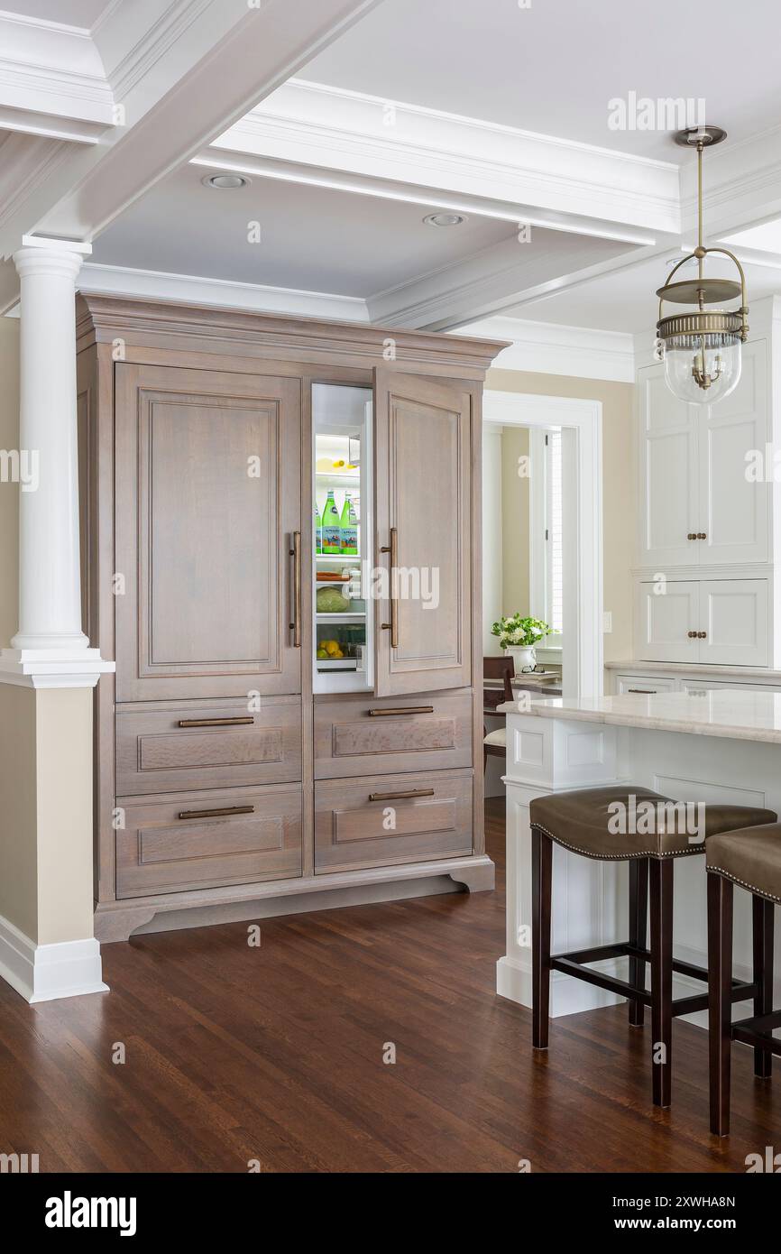 Two side by side Sub-Zero refrigerators encased in a unique wood ...