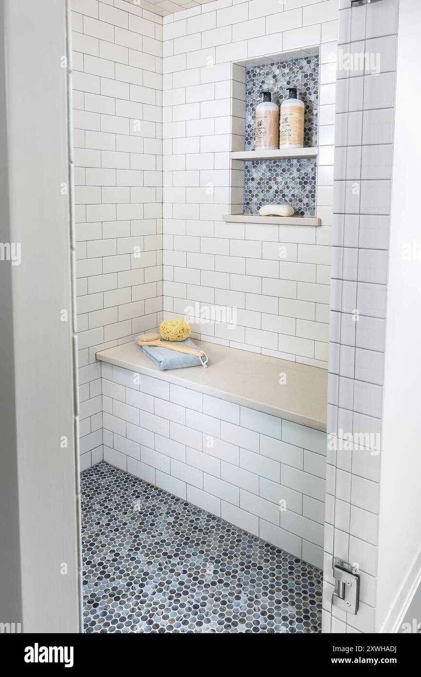 Interior of large walk-in shower with built-in bench Stock Photo - Alamy