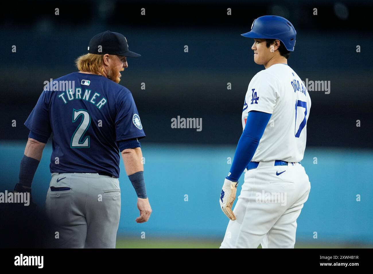 Seattle Mariners first base Justin Turner, left, talks to Los Angeles ...