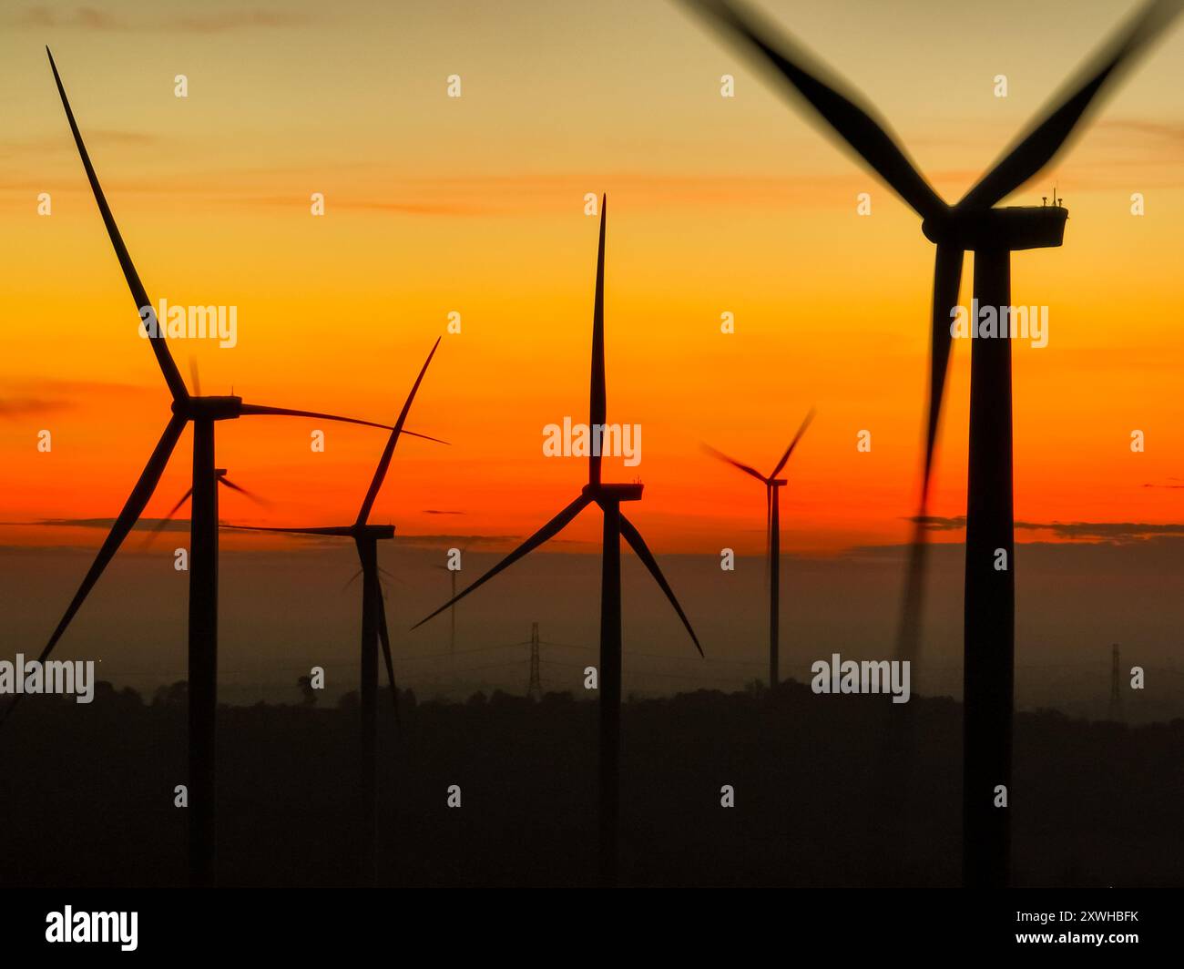 Wind farm field and sunset sky. Wind power. Sustainable, renewable ...