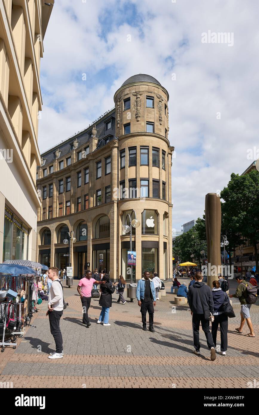 Tourists and residents in the Schildergasse, a popular shopping street ...
