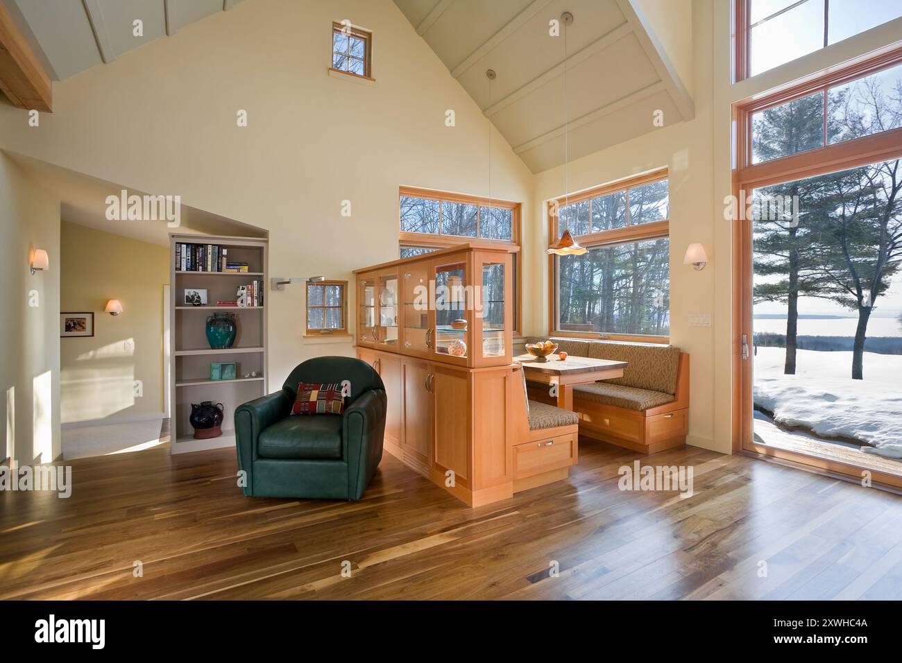Interior of modern cabin showing corner with built-in dining booth ...