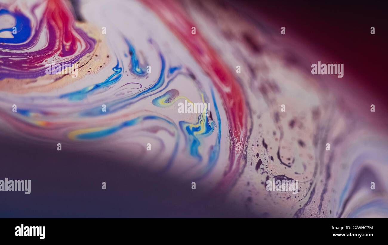 Oil fluid stain. Blur ink mix. Defocused purple pink blue yellow color ...