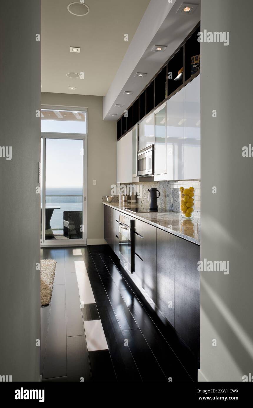Long vertical shot of modern kitchen with view to Lake Superior Stock ...