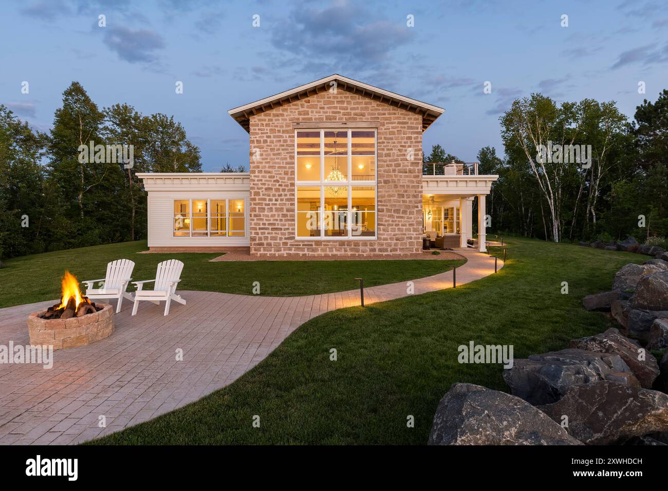 New stone house built in style of French farmhouse with round curving ...