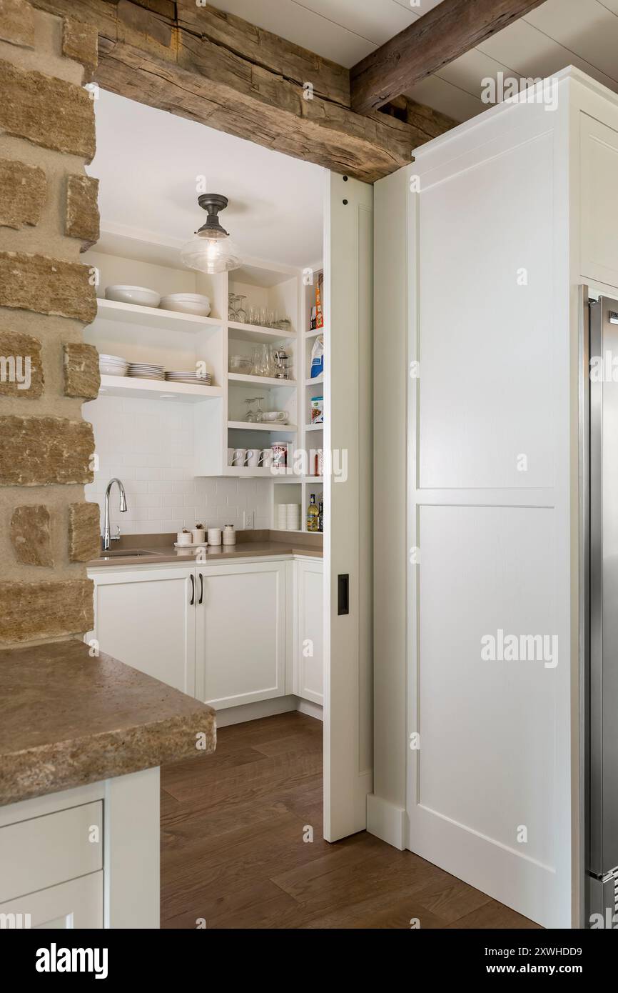 Looking into pantry of French farmhouse style kitchen Stock Photo - Alamy