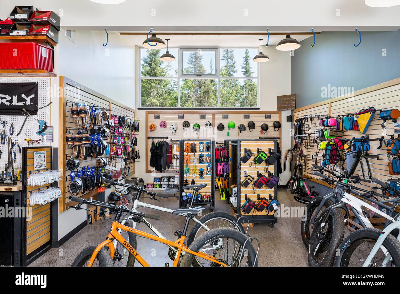 Interior of bike shop showing bicycles and other merchandise on display ...