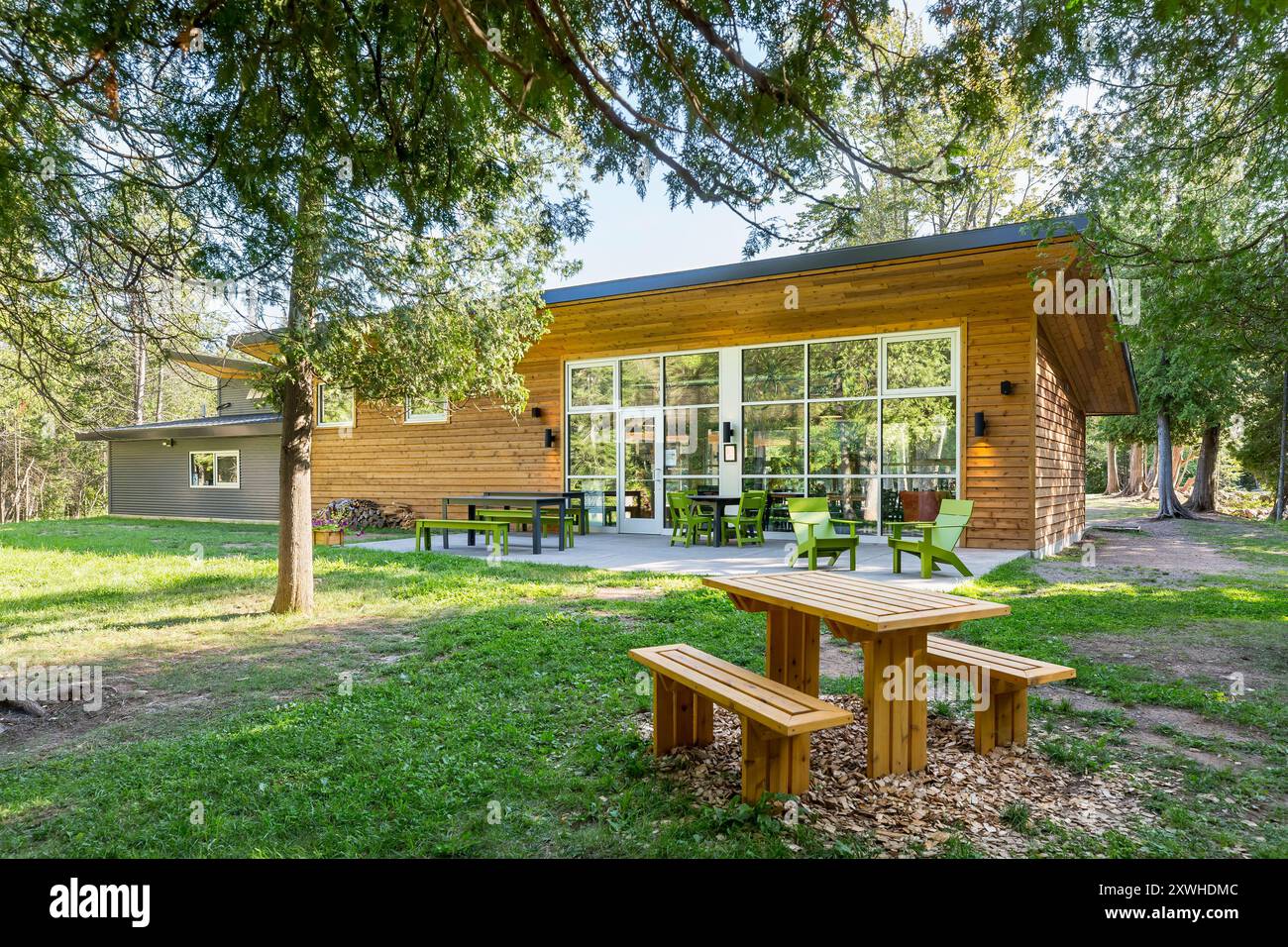 Green area and patio behind building with both a coffee shop and a ...