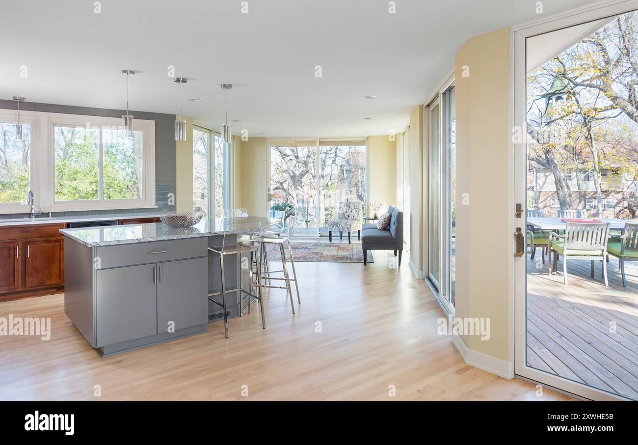 Kitchen and seating area with multiple windows Stock Photo - Alamy