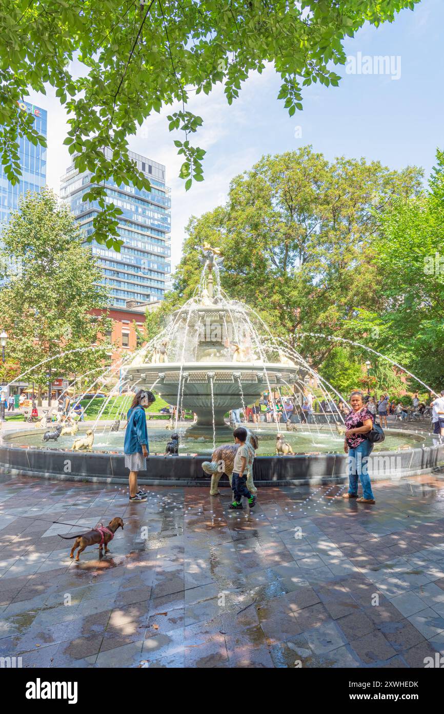 Unique fountain in Berczy Park downtown Toronto with numerous dog ...