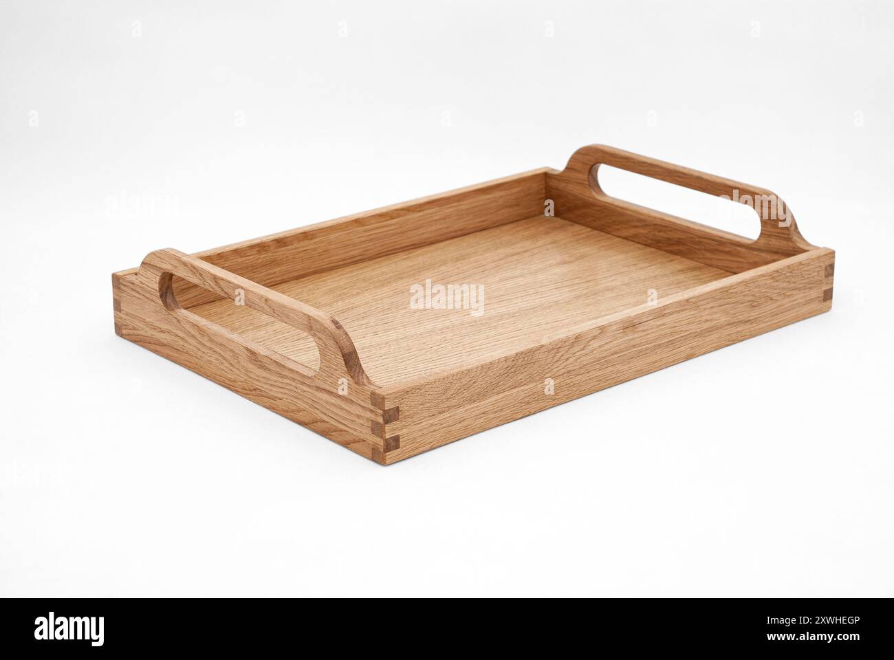 Elegant solid oak wood tray with dovetail joints and carved handles on ...