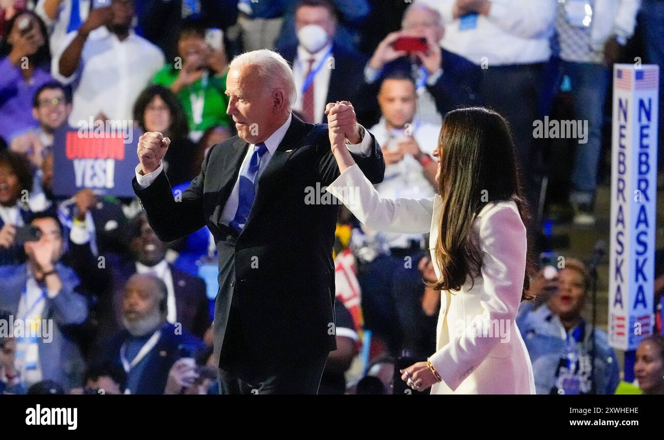 Chicago, United States. 19th Aug, 2024. President Joe Biden holds hands ...