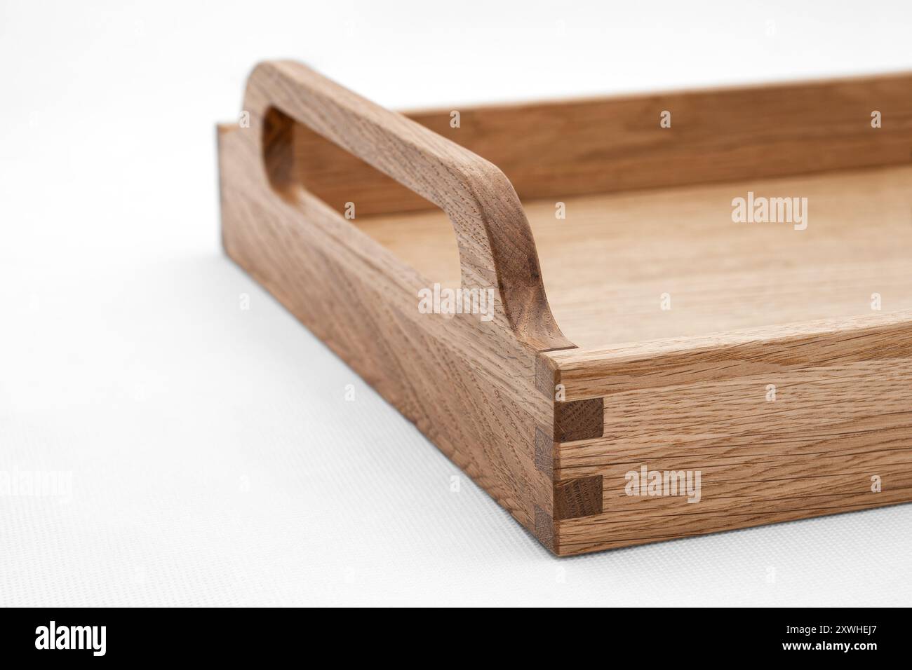 Elegant solid oak wood tray with dovetail joints and carved handles on ...