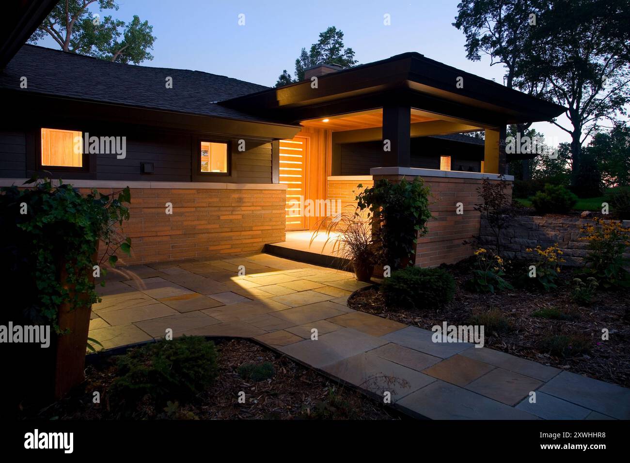 Front door of ranch style house with large overhang photographed at ...