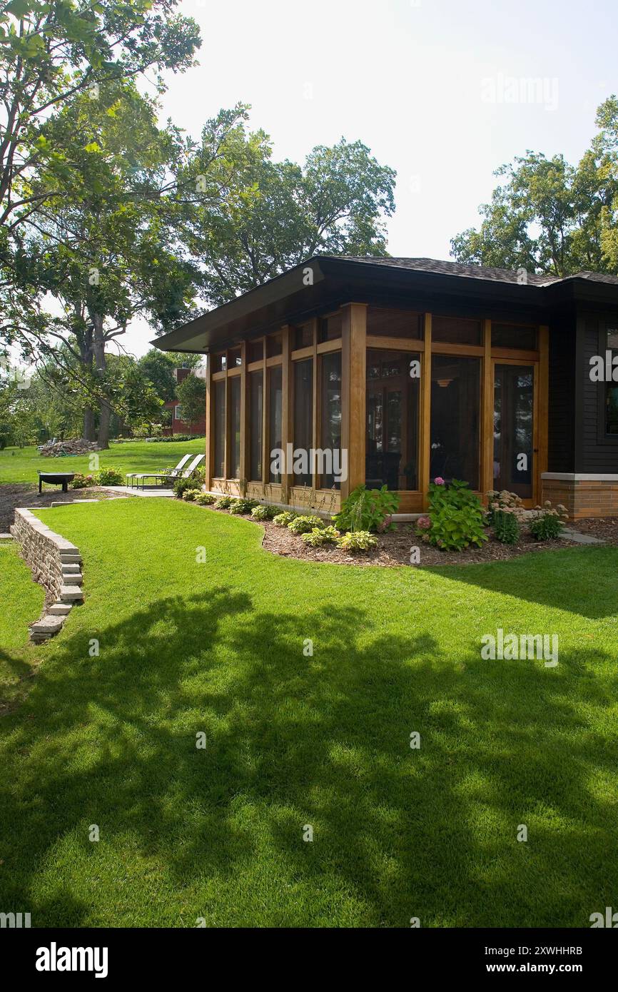 Back of ranch style house showing screened porch Stock Photo - Alamy