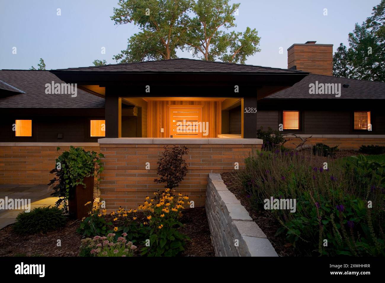 Front door of ranch style house with large overhang Stock Photo - Alamy