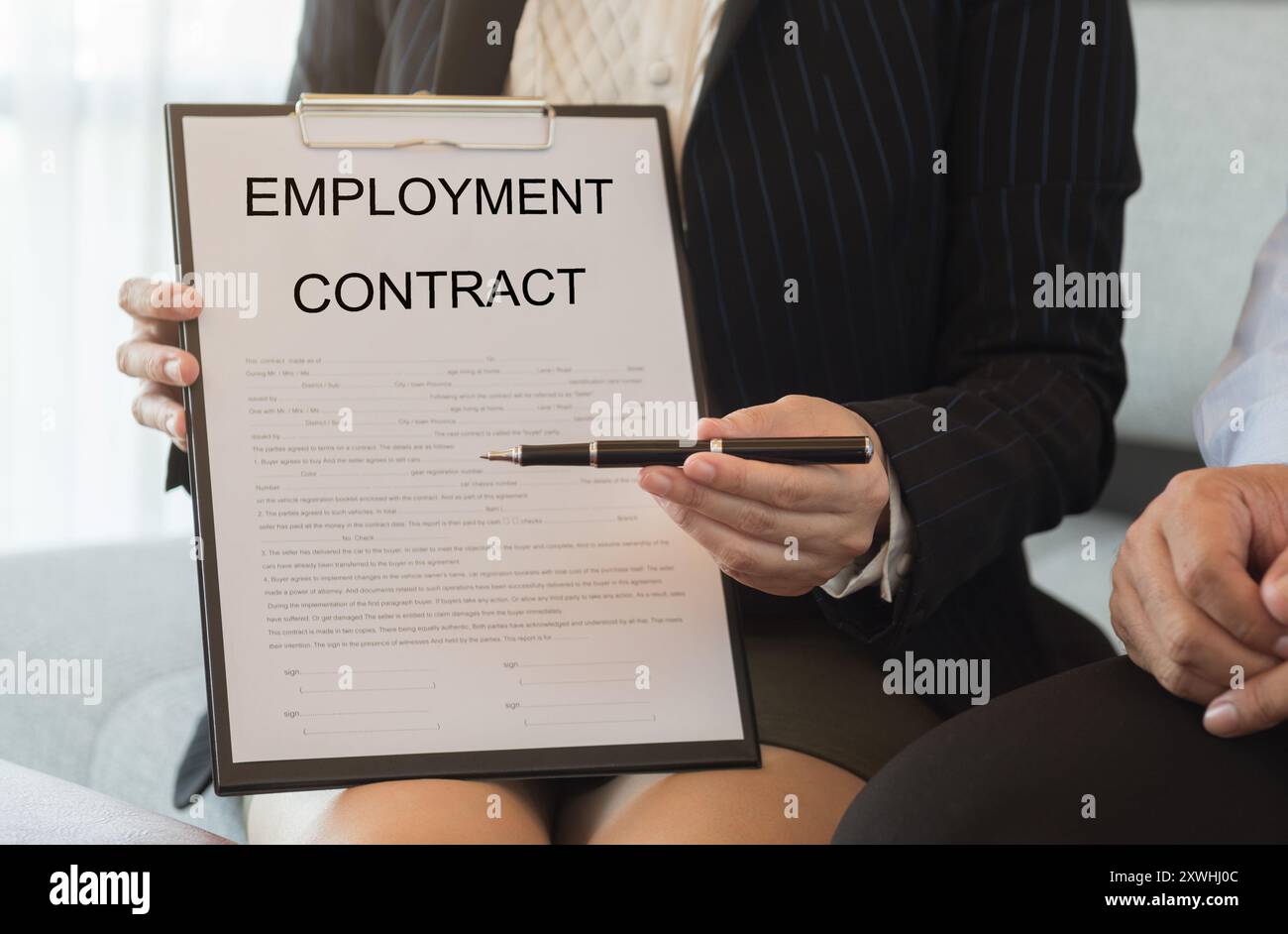 Business women sends pen and employment contract documents for signing ...