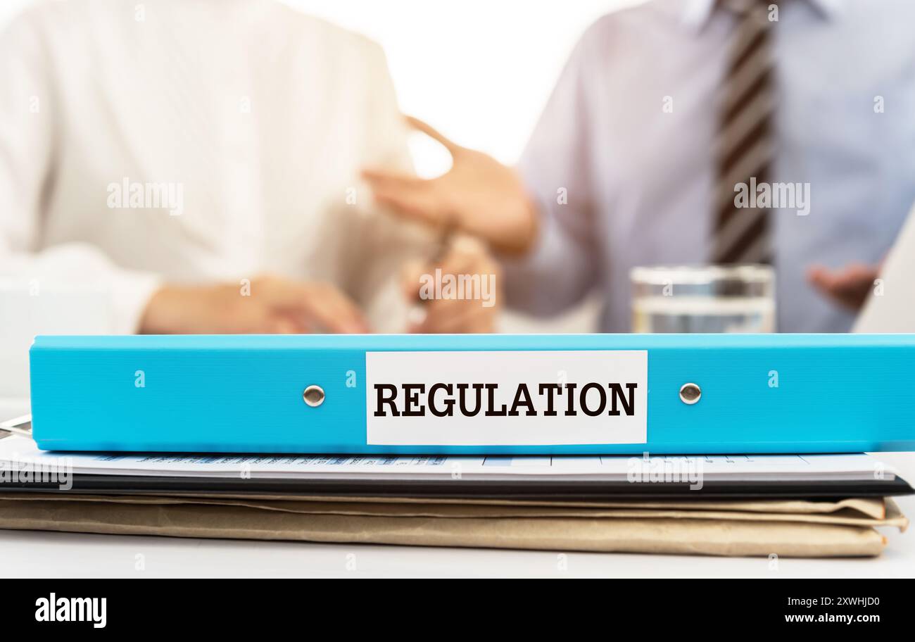 Regulation, regulation documents file on desk in meeting room. Rules ...