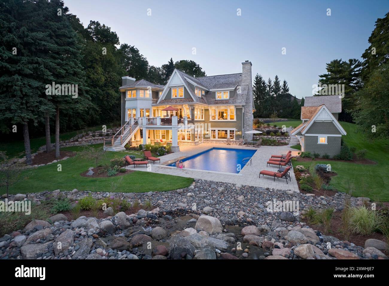 Backyard of house showing swimming pool and large water feature Stock ...