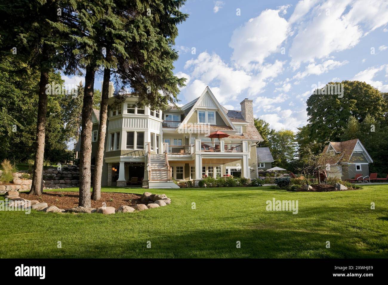 Back of house showing steps from deck leading down to backyard Stock ...