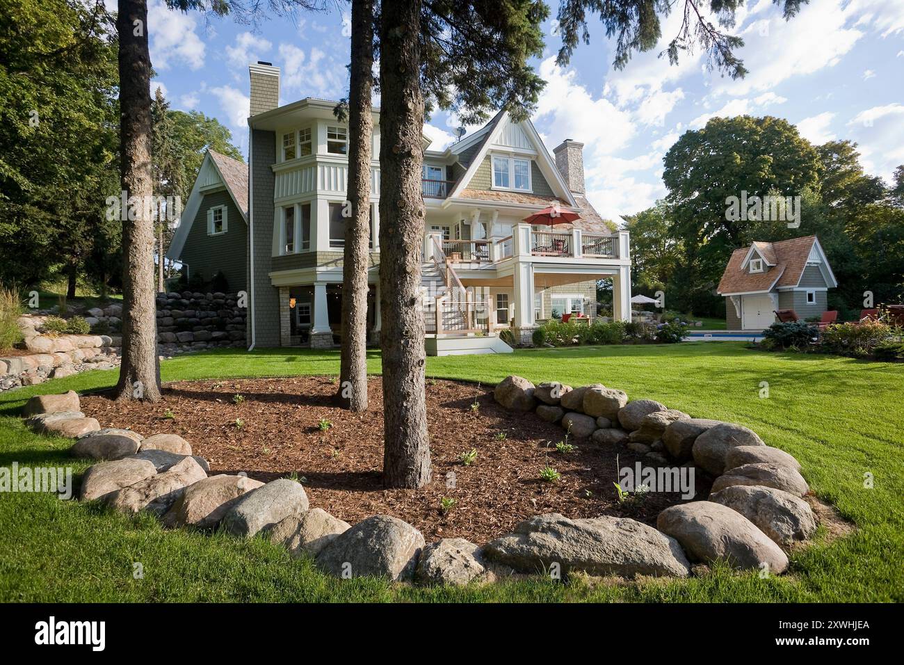 Back of house showing steps from deck leading down to backyard Stock ...