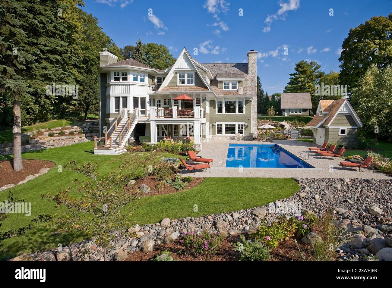 Backyard of house showing swimming pool and large water feature Stock ...