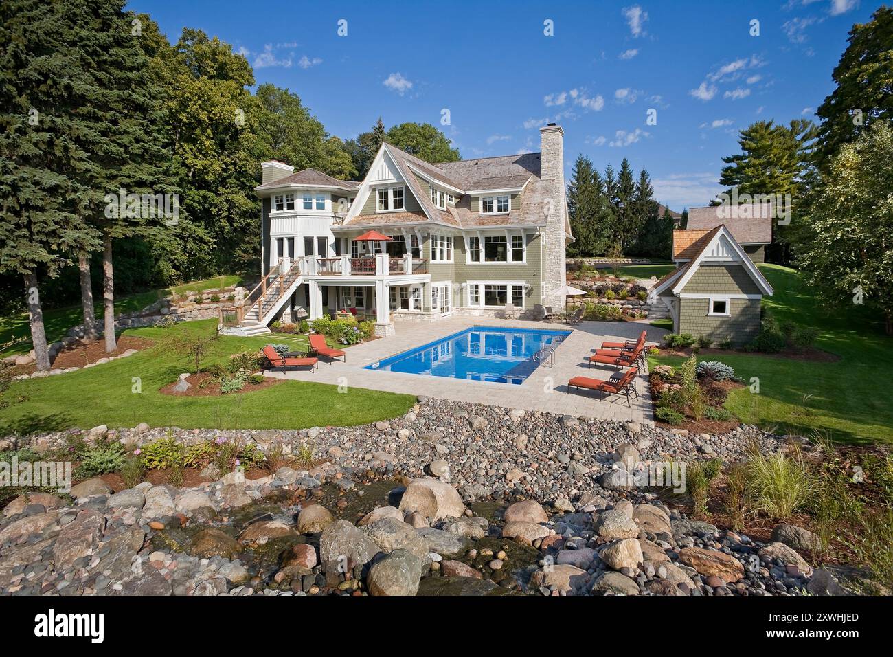 Backyard of house showing swimming pool and large water feature Stock ...
