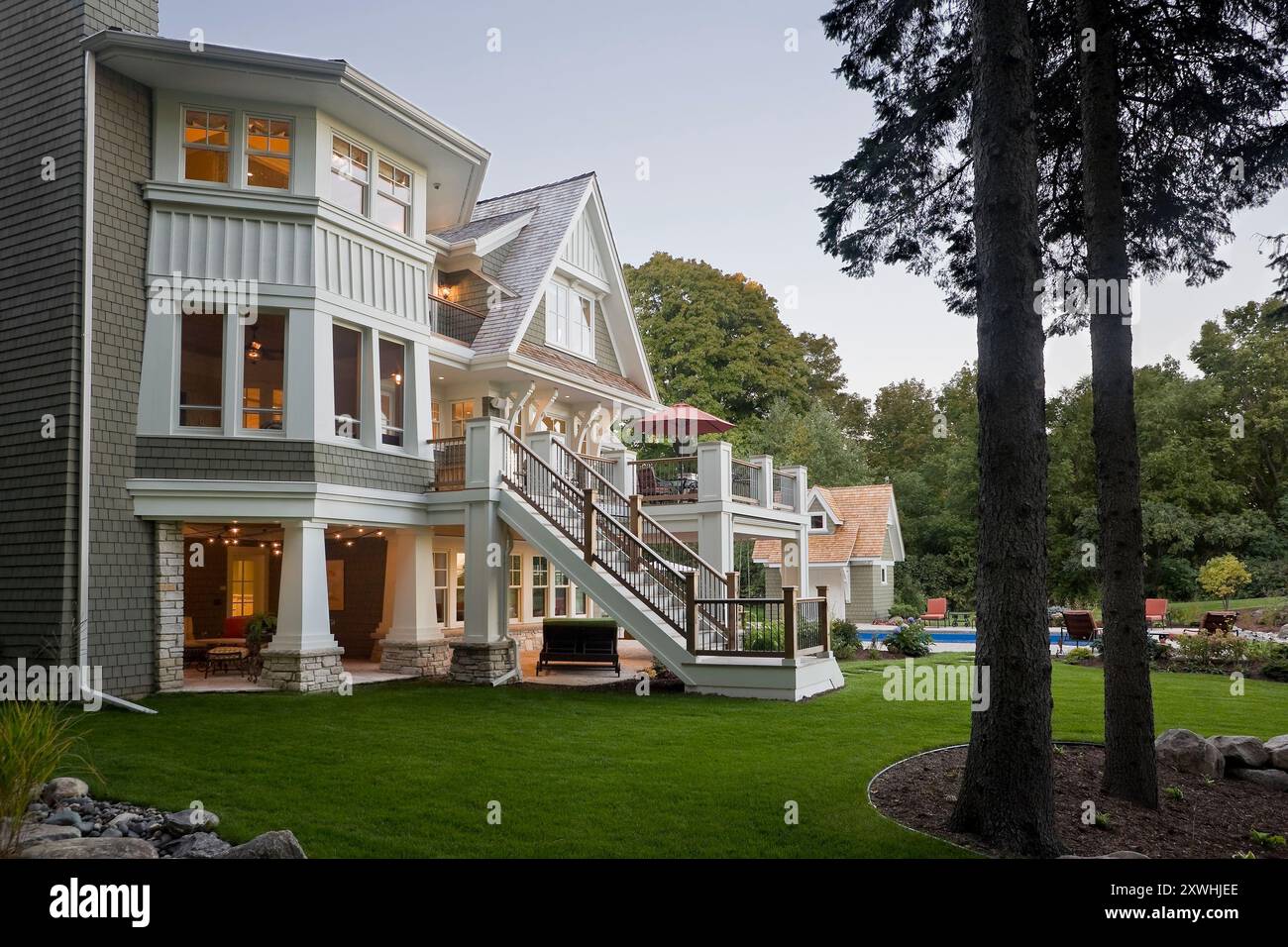 Back of house showing steps from deck leading down to backyard Stock ...