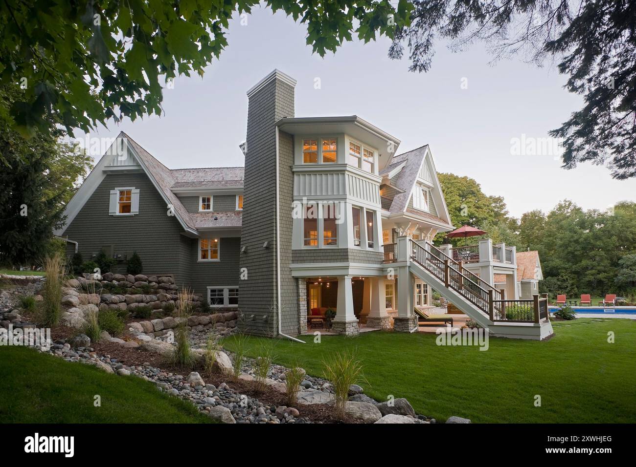 Back of house showing steps from deck leading down to backyard Stock ...