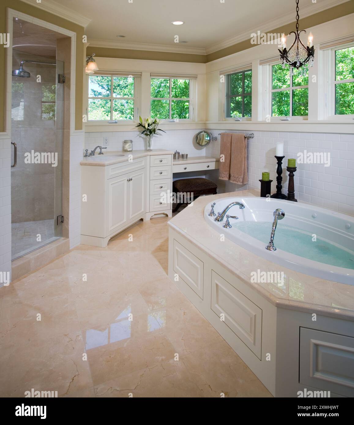 Bathroom with large platform Jacuzzi tub Stock Photo - Alamy