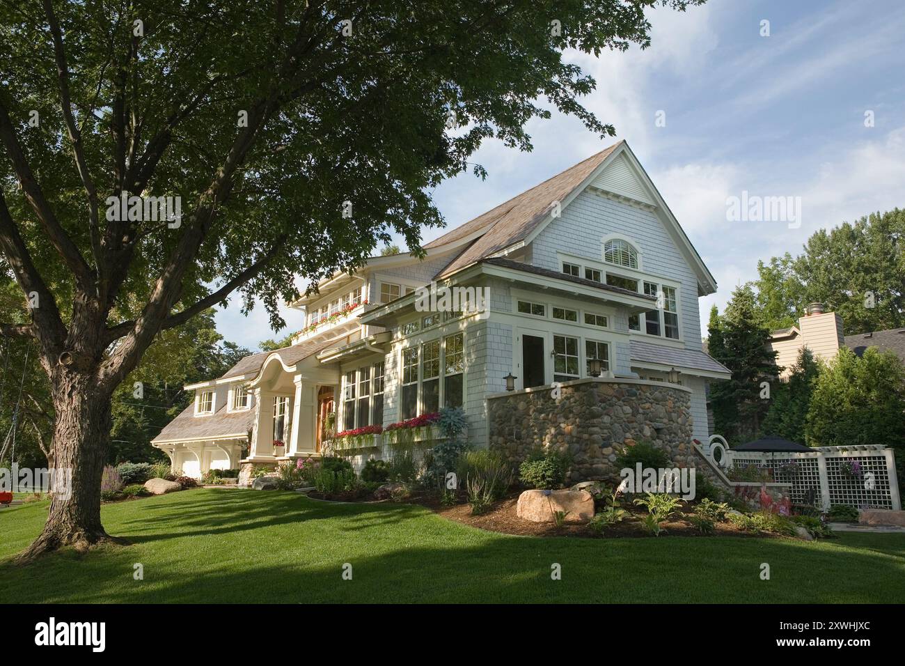 Exterior of large cottage style house on lake hi-res stock photography ...