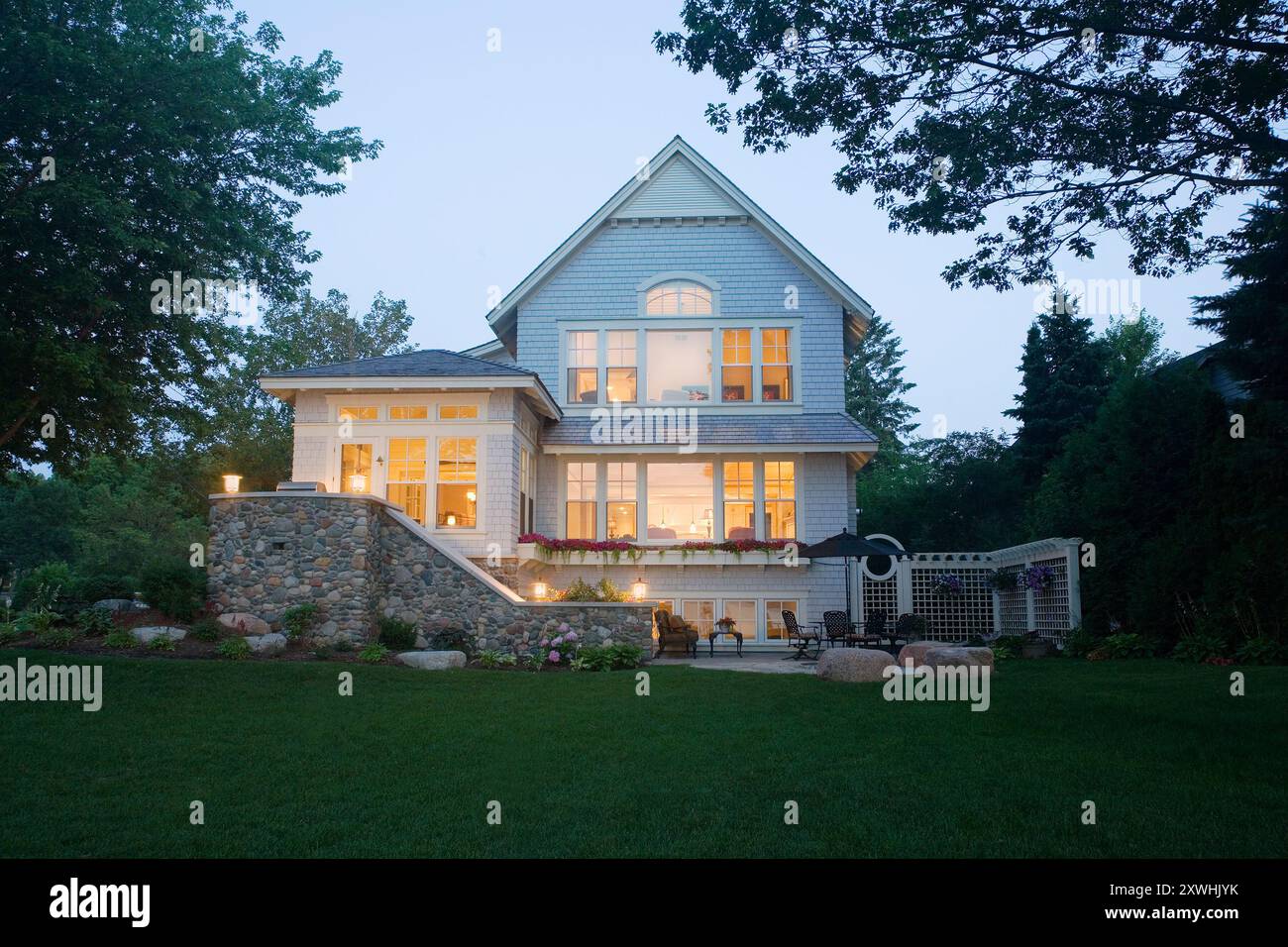 Exterior of large cottage style home on a lake Stock Photo - Alamy