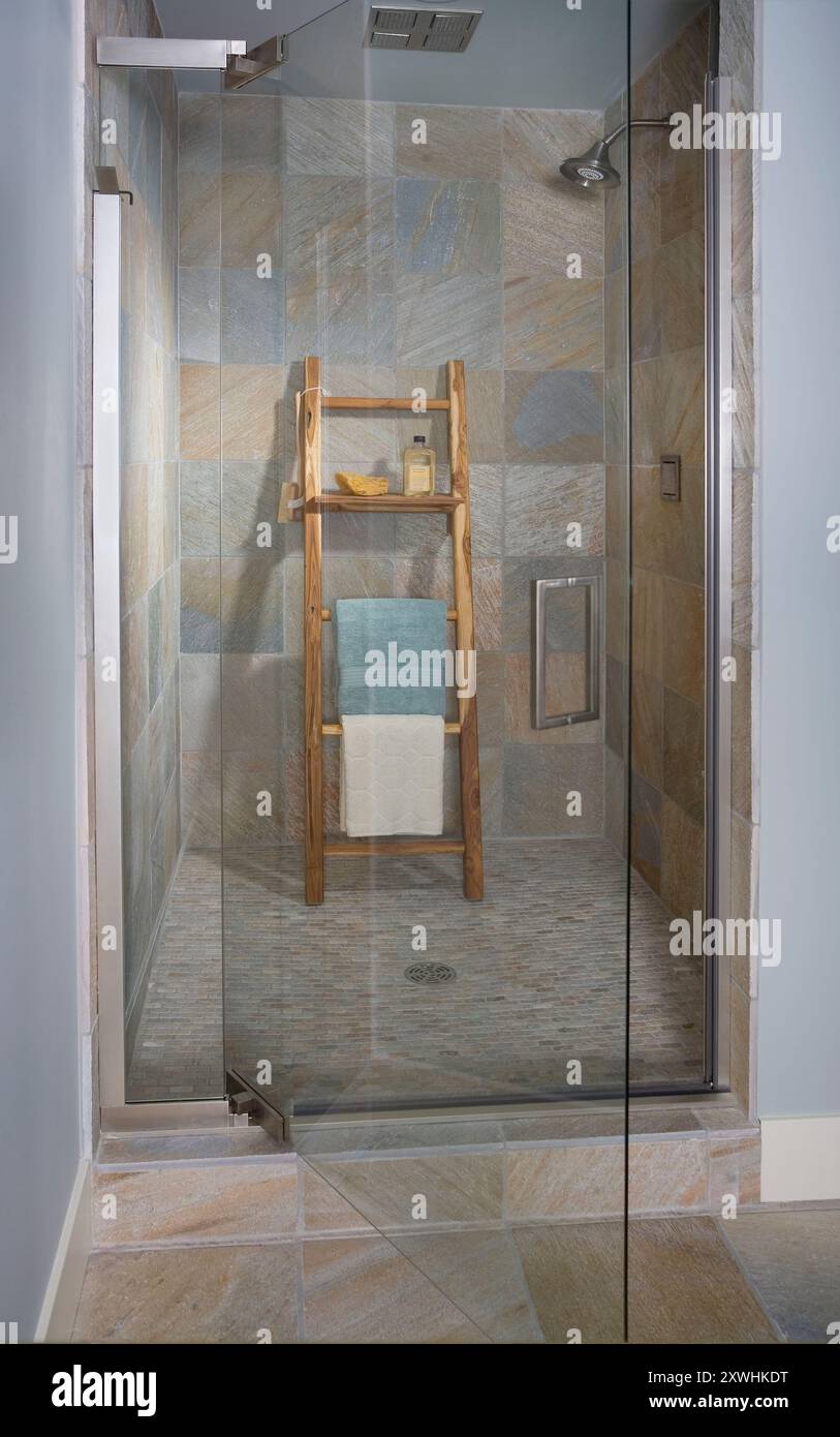 Shower in high end bathroom with quartzite tile and ladder towel holder ...