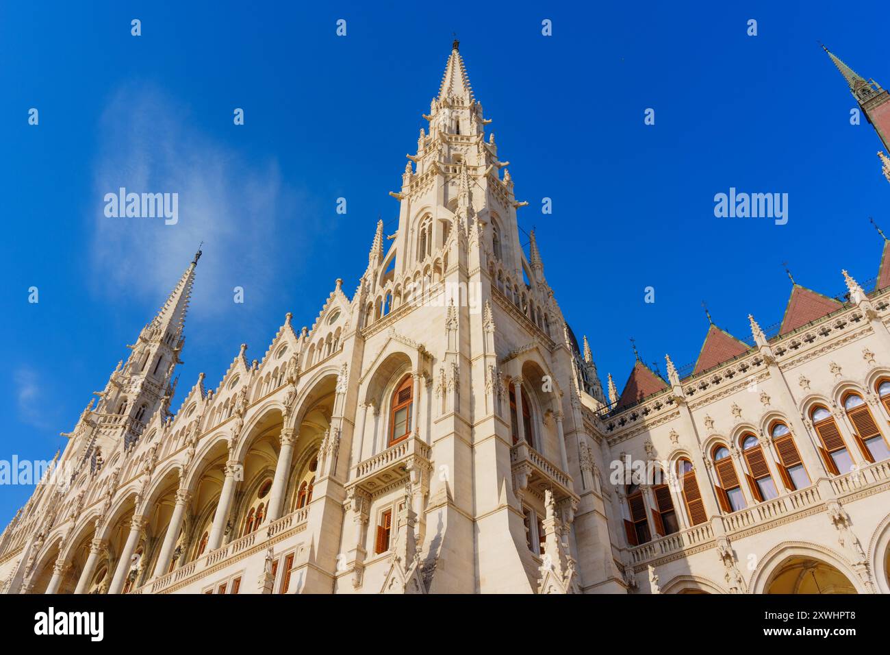 Tower of the Hungarian Parliament Building rising against a clear blue ...