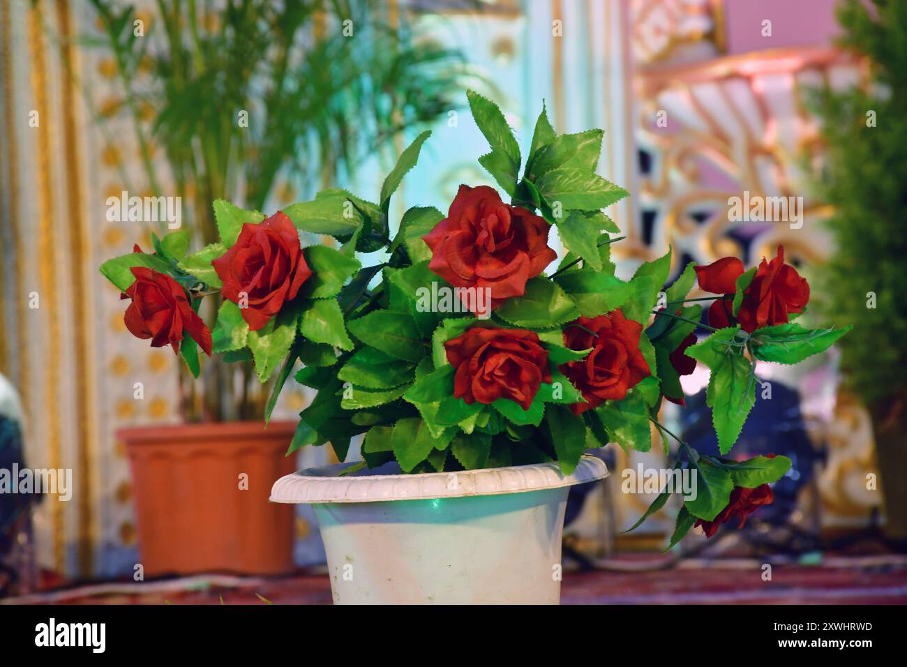 artificial roses in pots, Decorative red roses on the plastic vase ...