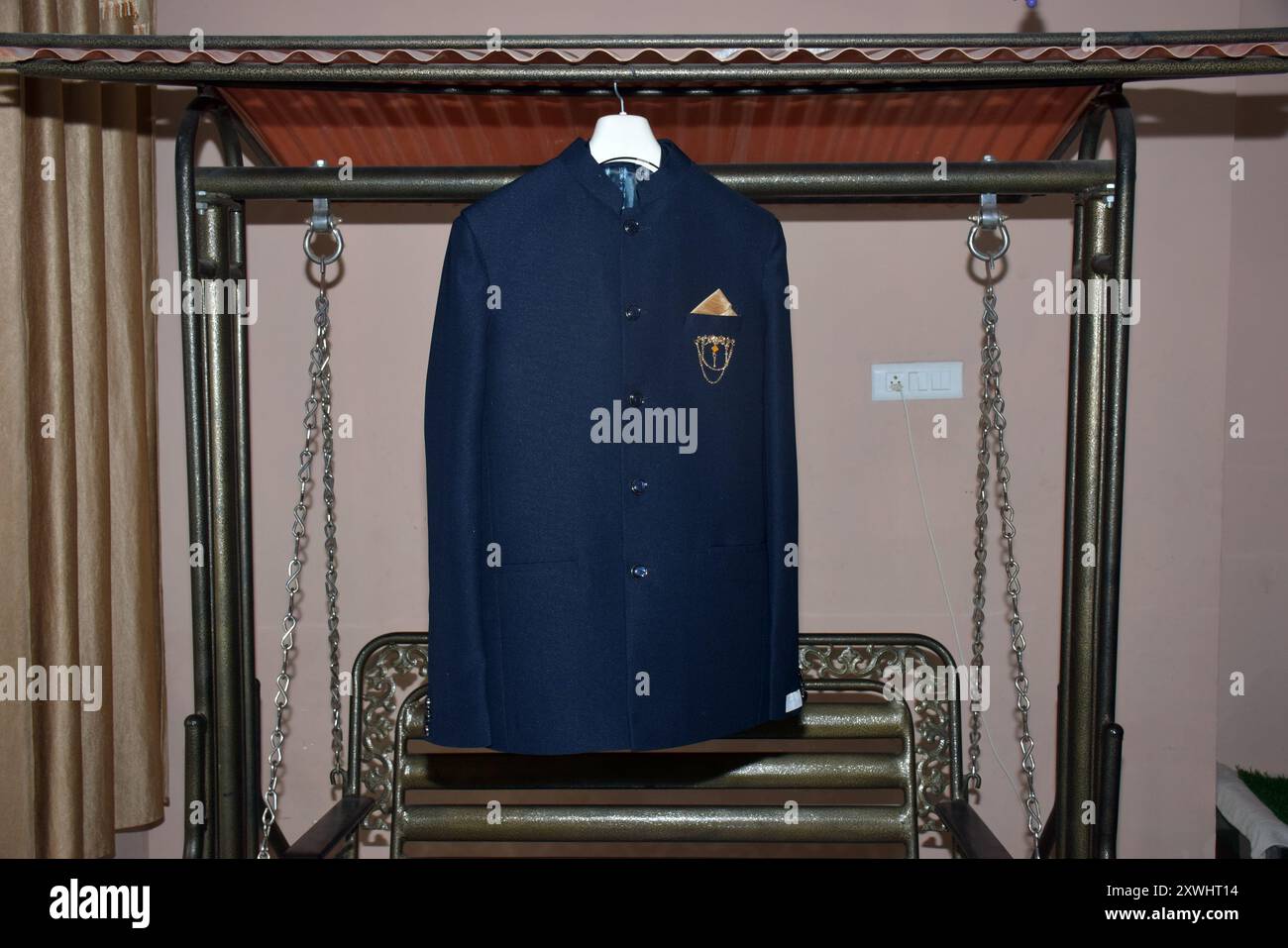 Dark blue men's jacket hanging on swing hanger. Men's style Stock Photo ...