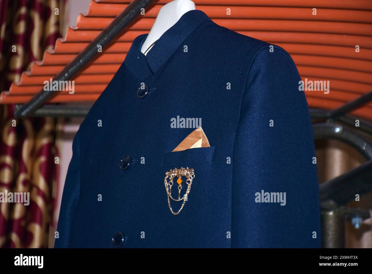 Dark blue men's jacket hanging on swing hanger. Men's style Stock Photo ...