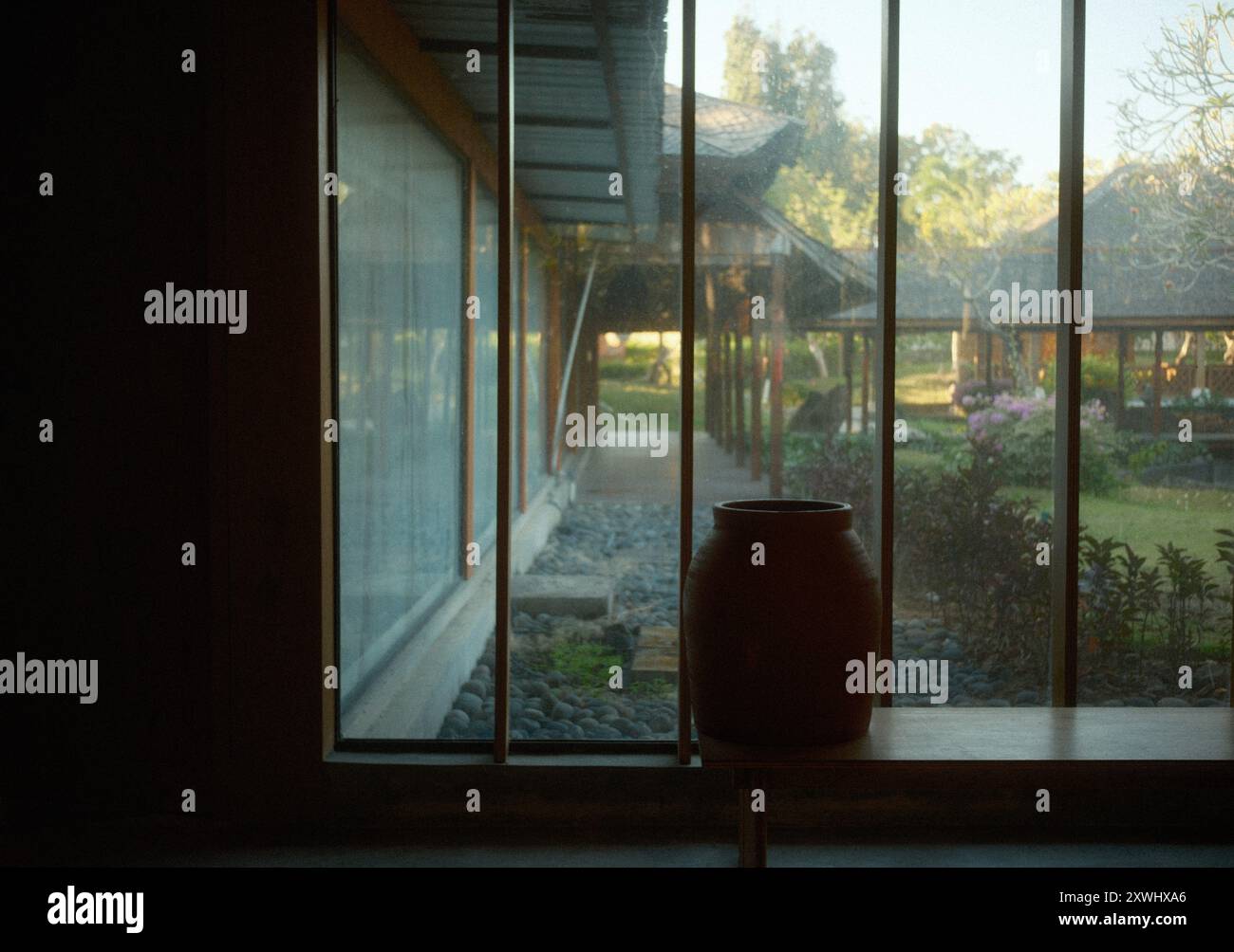 A decorative clay vase with large glass windows, overlooking a Japanese ...