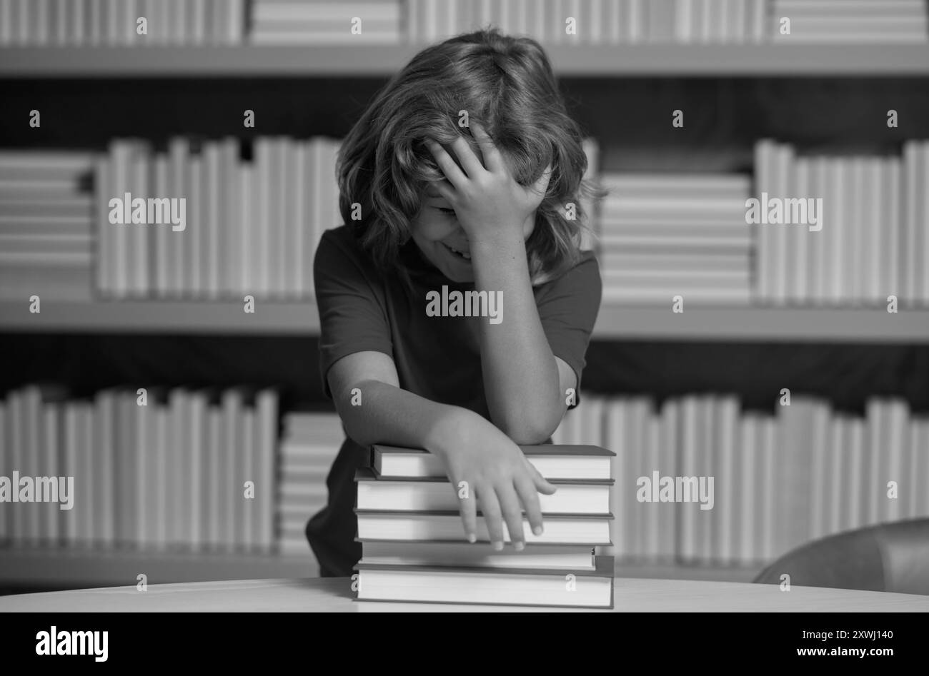 School boy, little student laughing on school library. Child from ...