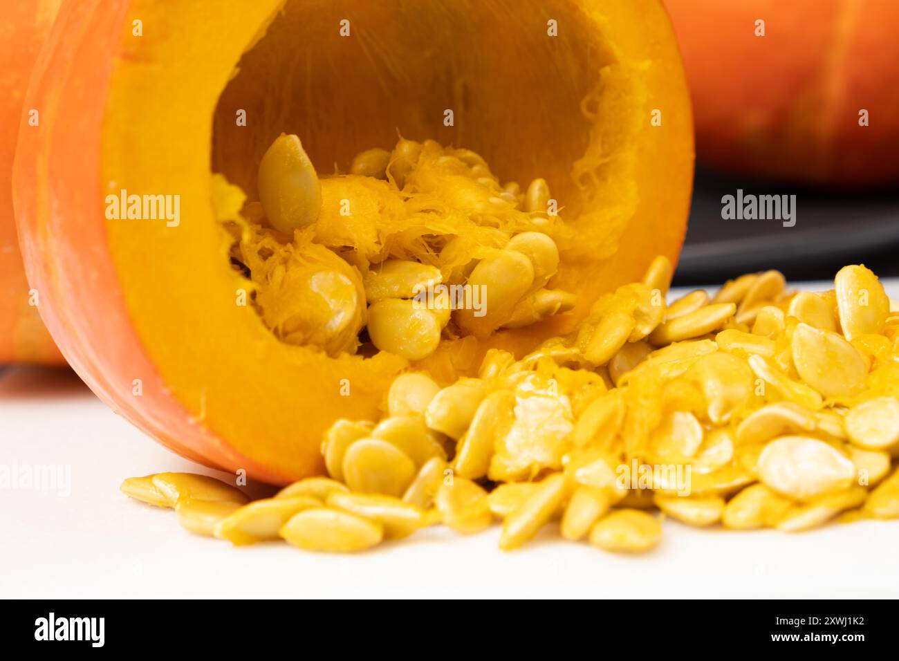 Hokkaido pumpkin seed extraction. Pumpkin inside with raw seeds Stock ...