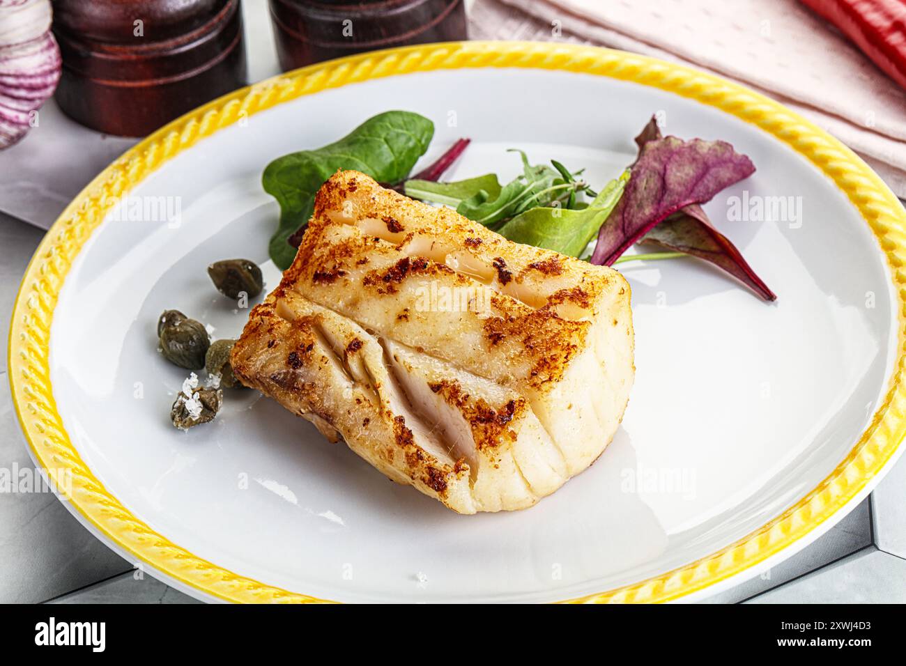 Roasted cod fish steak with salad leaves Stock Photo - Alamy