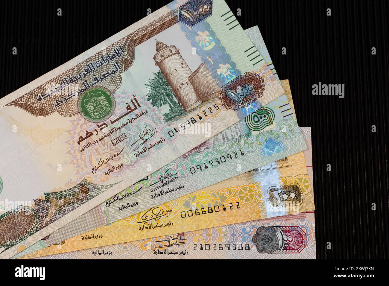 United Arab Emirates currency notes dirhams on back background. Close ...