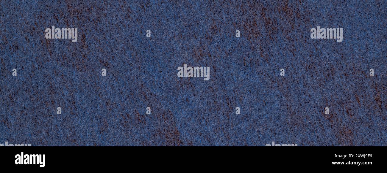 Construction of a navy blue background with brown spots of felt fabric ...