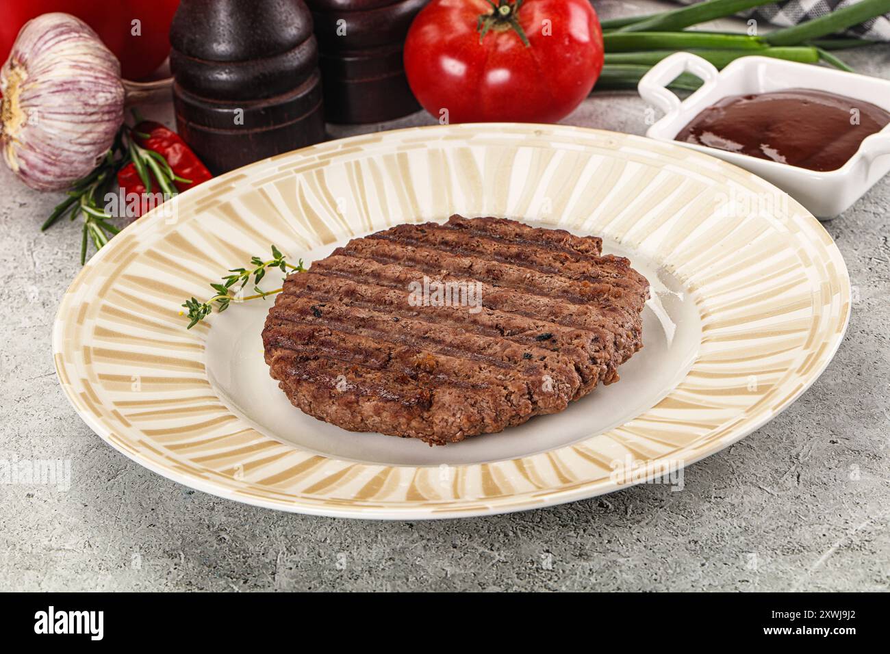 Grilled minced beef burger cutlet served thyme Stock Photo - Alamy