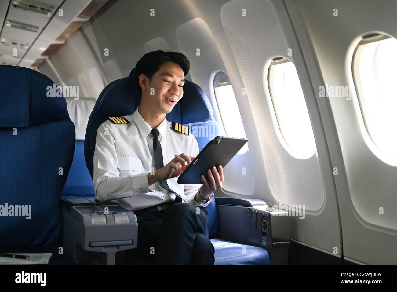 Captain checking flight document hi-res stock photography and images ...