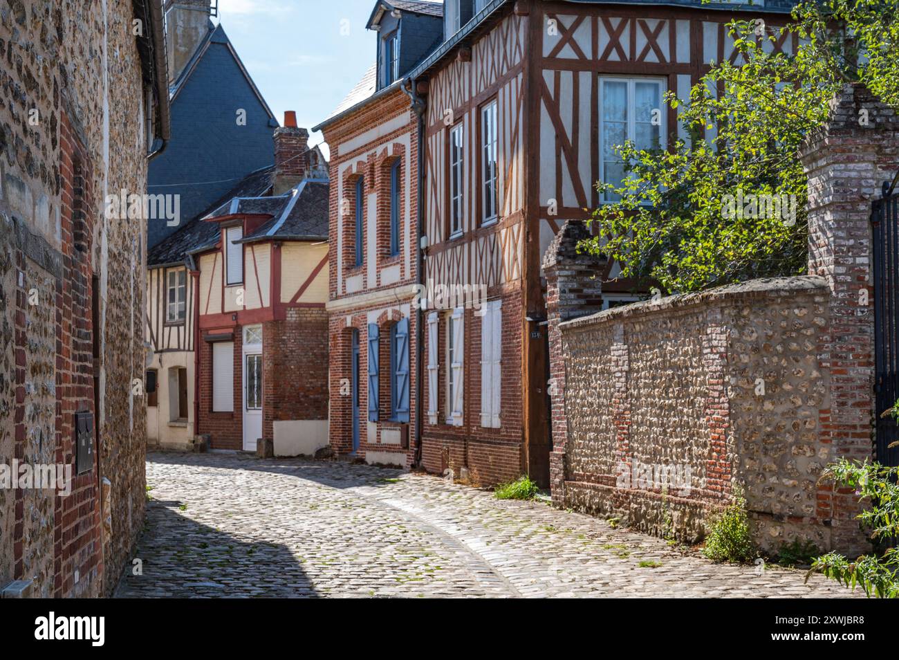 Old street with cobbled stone in the historic heart of Bernay, a small ...