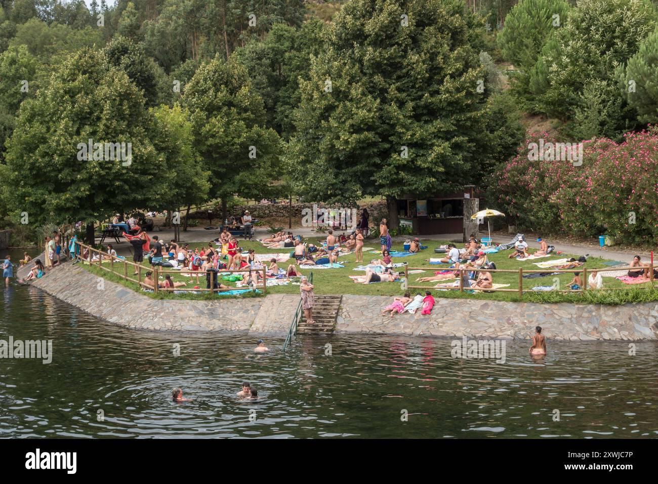 A busy river beach (praia fluvial) at Aldeia Ana de Aviz, near Figueiró ...