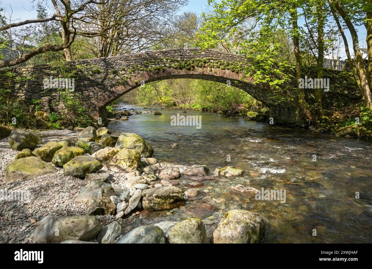 Stone bridge across River Derwent in spring Longthwaite Borrowdale ...