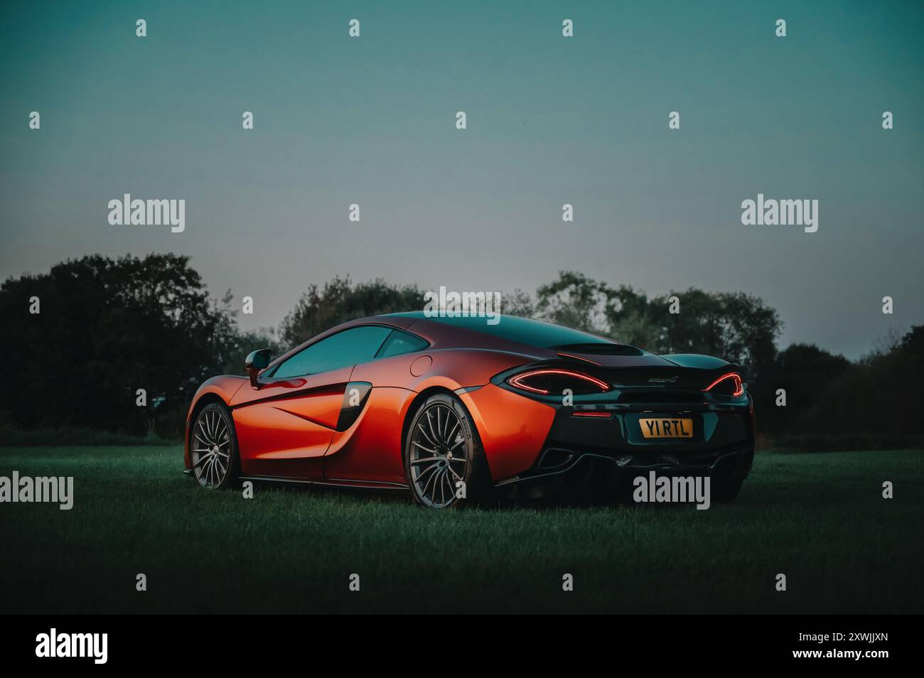 McLaren 570 GT - Volcano Orange Stock Photo - Alamy